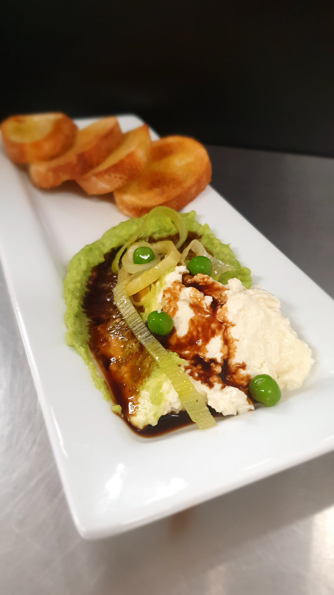 Leek & Pee Puree with whipped feta on a crostini – Olea Oil and Vinegar